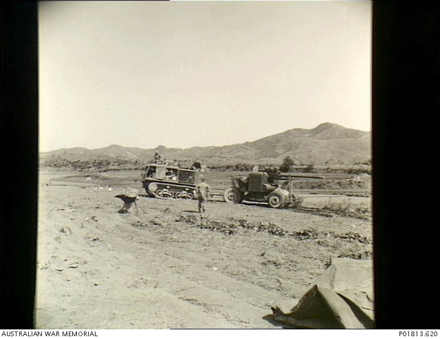 Korea, c. 1950-10. A US Army tractor (left) pulling an American trailer ...