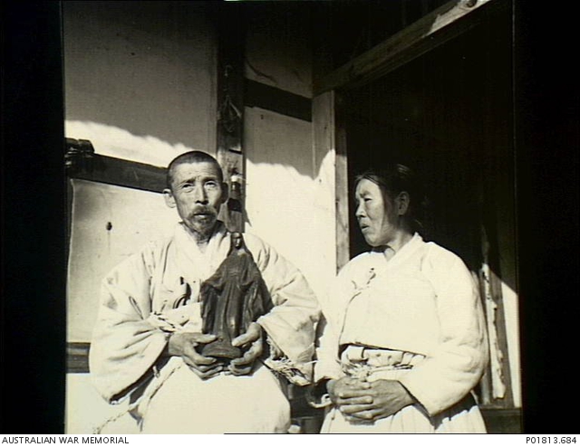 Korea, c. 1951-02. Dressed in traditional peasant costume, a Korean ...