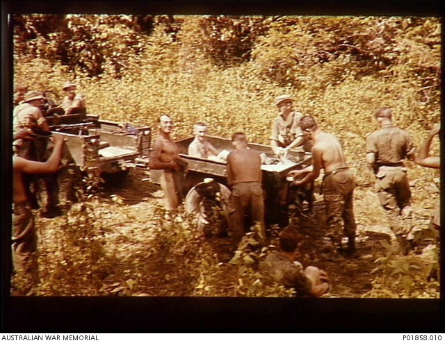 Perak State, Malaya. During a brigade exercise in the bush, members of ...