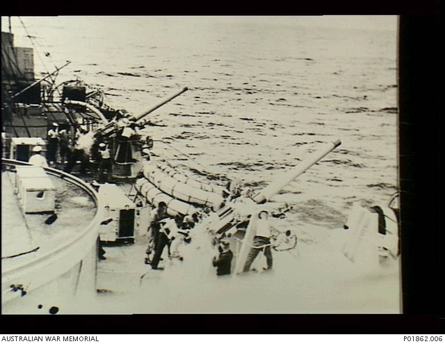 At sea off the coast of NSW. Gun crews of the RAN cruiser HMAS Canberra ...
