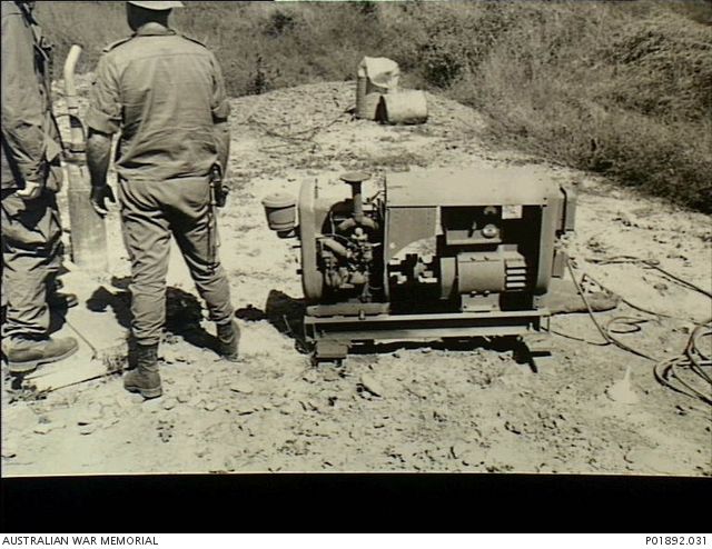 Vietnam. c. 1969. A 5KVA generator in the field at a base camp ...