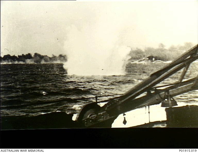 15 inch shells exploding in the water between HMS Gloucester and HMAS ...