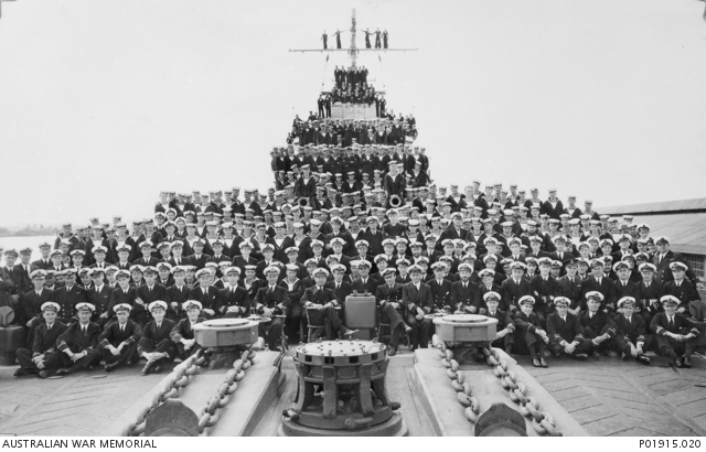 Formal group portrait of the crew of HMAS Perth on the deck of HMAS ...