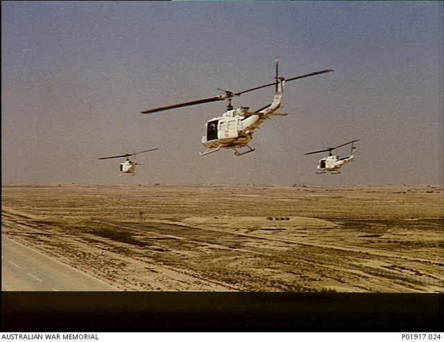 Iroquois helicopters 0-60809, A2-915, and A2-488 taking off from El ...