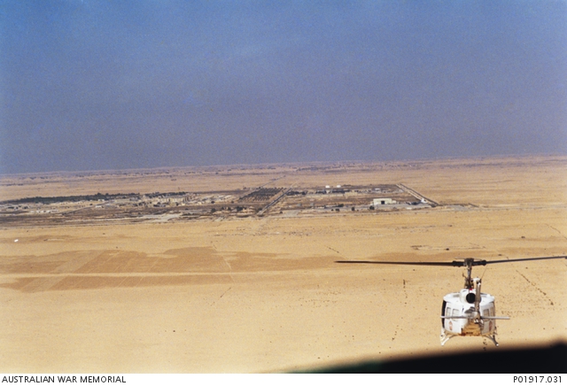 Four Iroquois helicopters returning to base at El Gorah airfield. Three ...