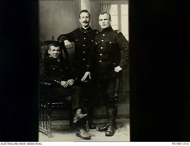 Studio portrait of three Prisoners of War (POW) at German POW Camp ...