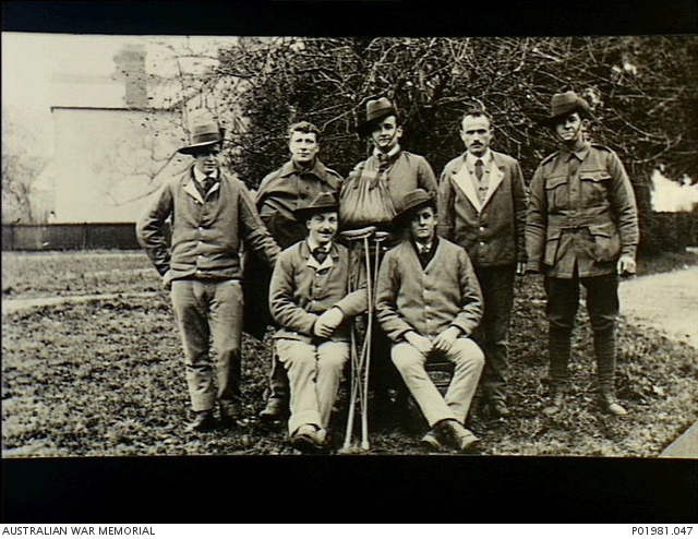 Outdoor portrait of a group of seven Australian ex-Prisoners of War ...