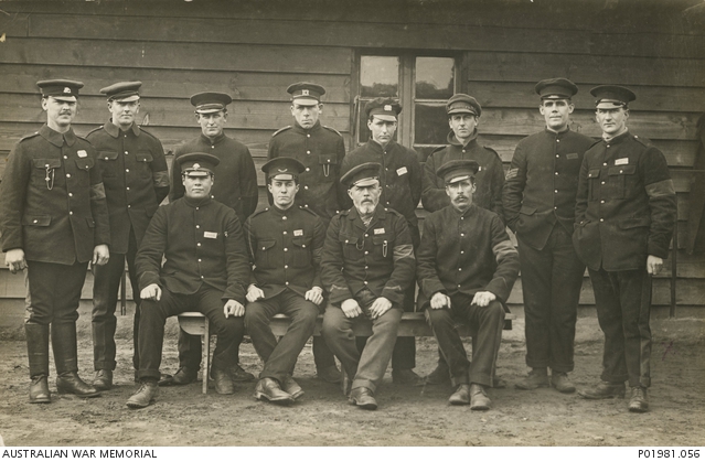 Outdoor group portrait of twelve allied Prisoners of War (POW) in the ...