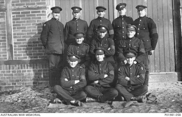 Outdoor portrait of a group of eleven Australian Prisoners of War (POW ...