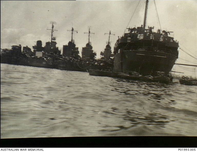Stern view of the submarine tender, USS Fulton, (right), with four US ...