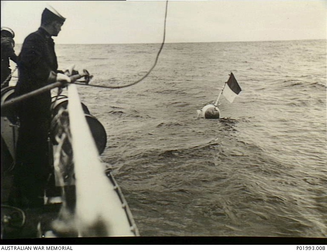 c.1943. A recently launched paravane is observed by crew from the ...