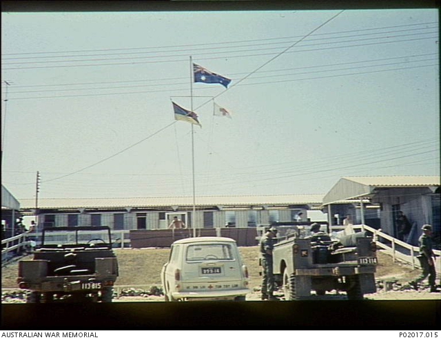 An Australian Red Cross Volkswagen sedan parked between 8 Field ...