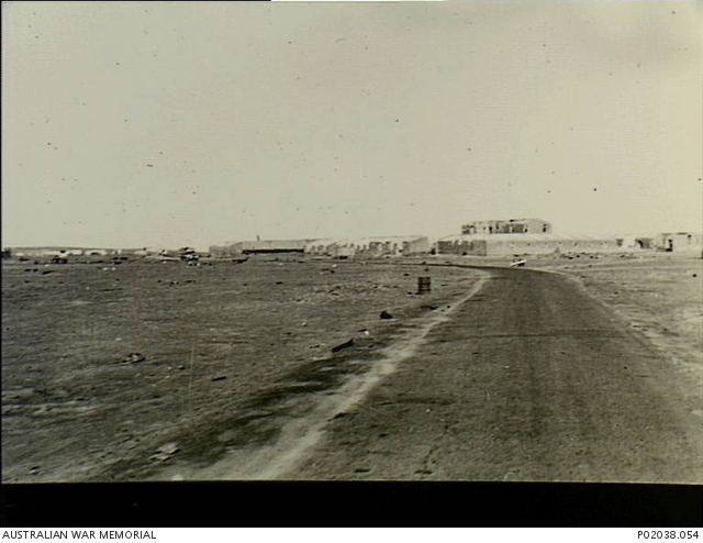 Sidi Barrani, Egypt. 1940-12-18. Debris strewn beside the road leading ...