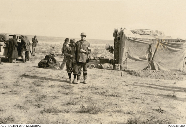 Bardia, Libya. 1941-01-04. An Italian prisoner of war (POW) posing with ...