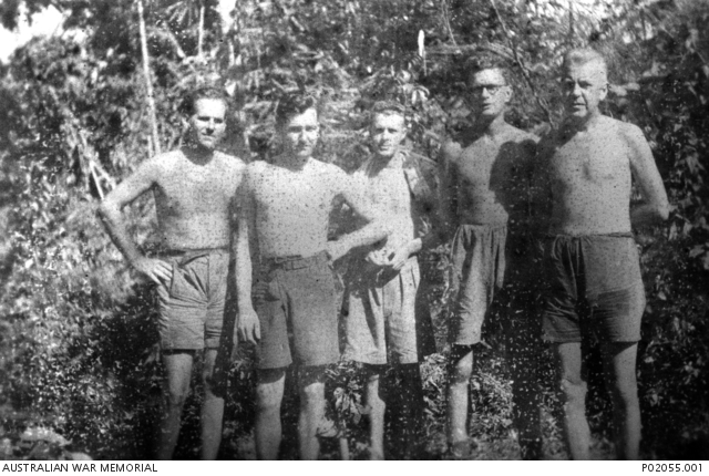 Group portrait of prisoners of war (POWs) standing outside the ...