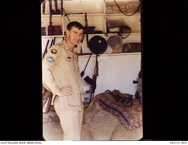 Khyber region, Pakistan. c.1989-10. Captain Andrew Smith standing in a ...