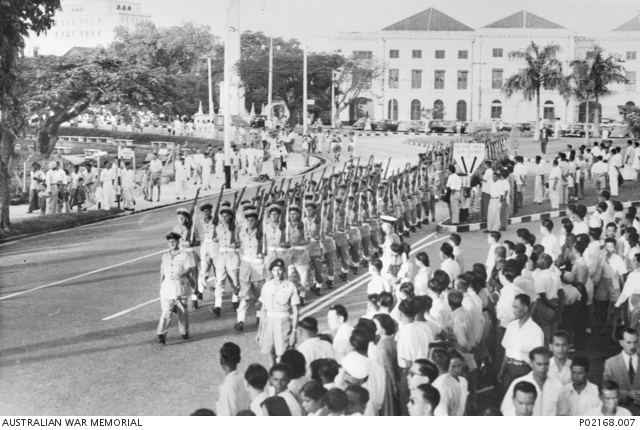 Singapore. 1954-06-10. Crowds line the street as members of No. 1 ...