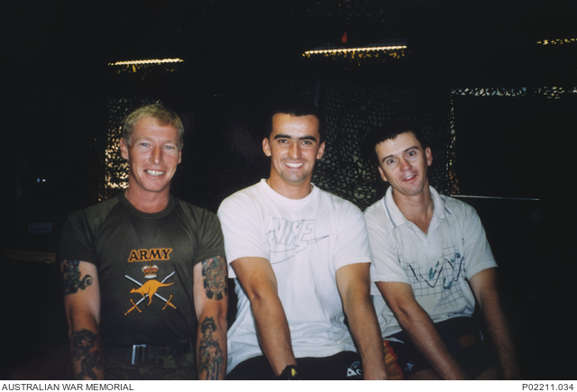 Three Royal Australian Signals Corps (RASIGS) servicemen relaxing in ...