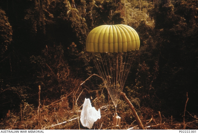 A resupply parachute about to land in the jungle of Northern Malaya ...
