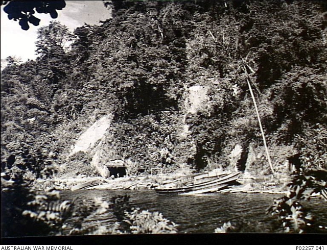 Rabaul, New Britain, 1945-10. Japanese barges lie hauled up on the ...