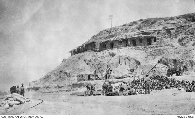 Gallipoli, Turkey, 1915. Soldiers at Cape Helles sit or stand near some ...