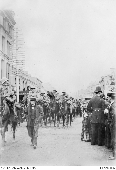 Men of a contingent of NSW Imperial Bushmen riding along William Street ...