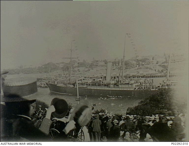 The steamship SS Moravian being towed away from its berth by a small ...