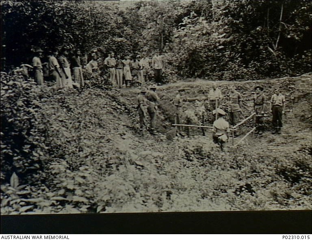 Anaquin, Burma. 26 September 1945. A grave, believed to be of ten men ...