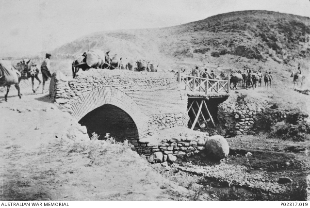 Persia. 1918. Members of Dunsterforce crossing a stone and wooden ...