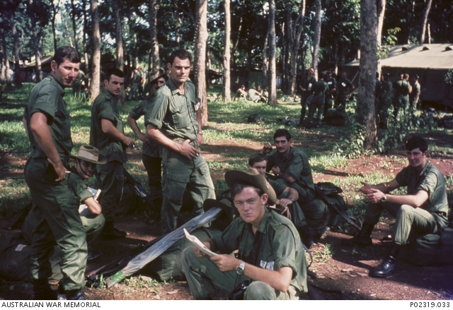 Gathered in the shade of some trees at the 1st Australian Task Force ...