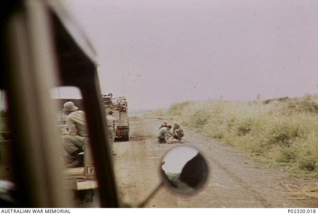 South Vietnam, c. 1969. A convoy of Australian military vehicles ...