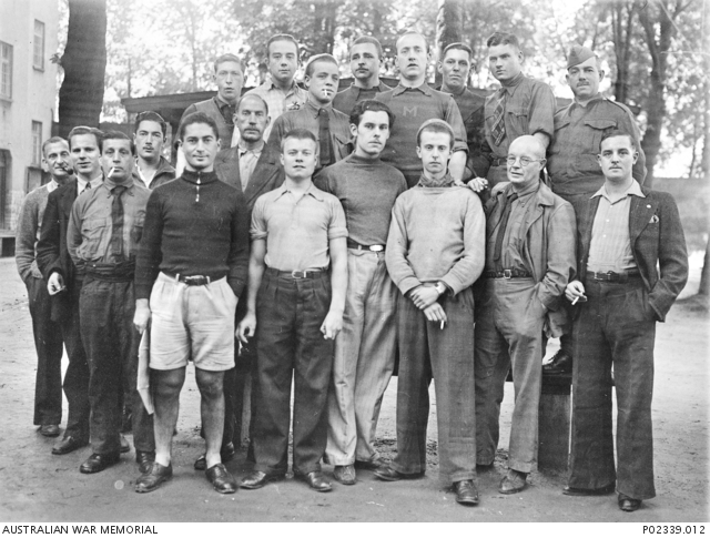 Tost, Germany. Informal outdoors group portrait of civilian internees ...