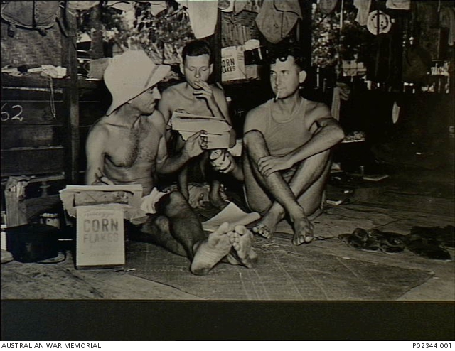 Changi, Singapore. c. August 1945. Three men who were prisoners of war ...