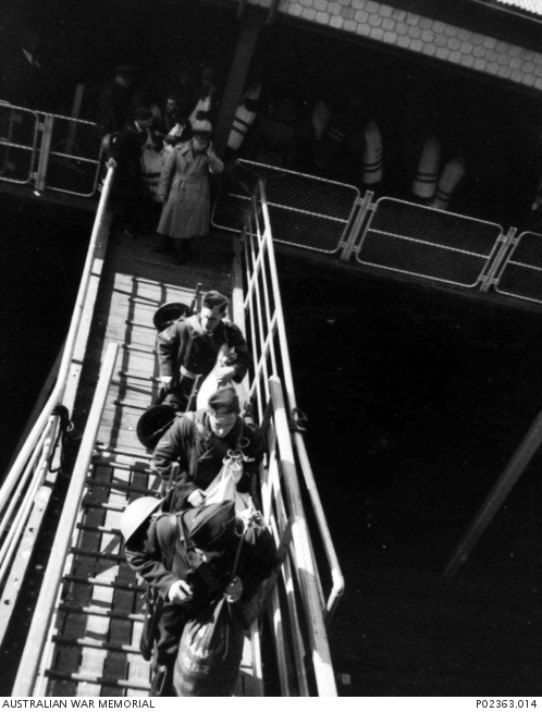 Three members of the RAAF walk up the gangplank of the P&O ship SS ...