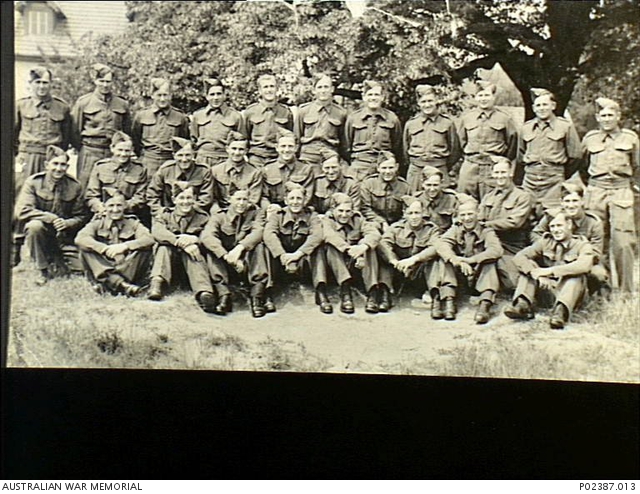 Outdoors group portrait of Australian prisoners of war (POWs) from NSW ...