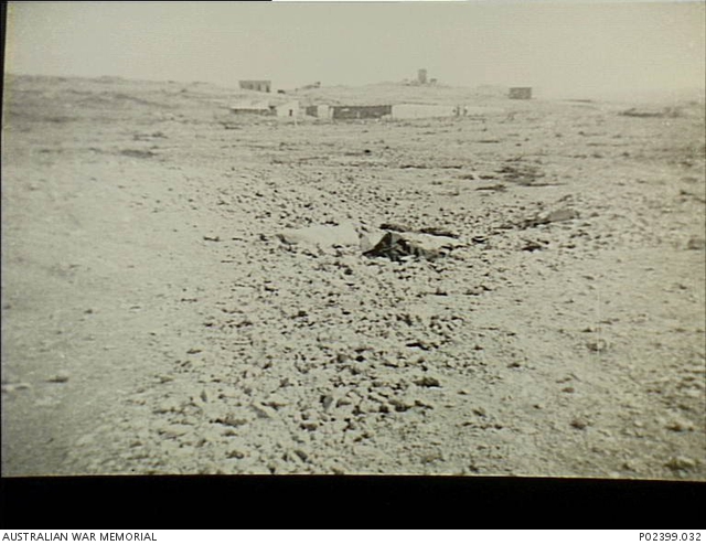 Bardia, Libya. c. 1940. Pieces of clothing amongst the stones of ...