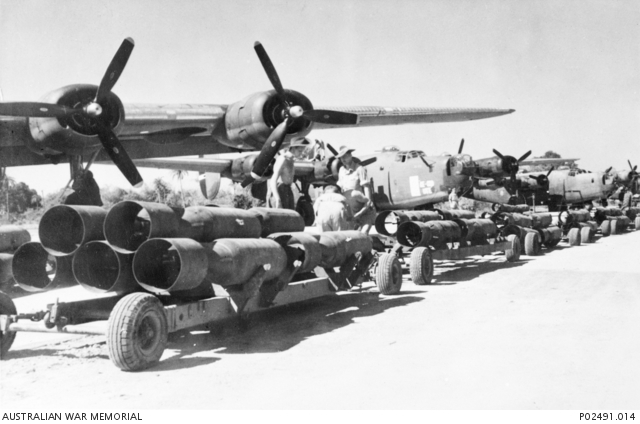 India/Burma. c. 1945. Ground staff and their bomb trolleys prepared for ...