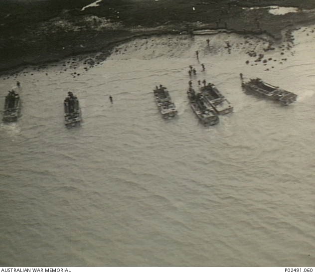 Burma. 1 May 1945. Landing barges unloading their troops onto a beach ...