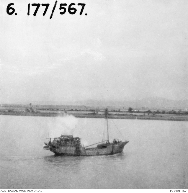 Salween River, Burma. 19 February 1945. A small wooden coaster headed ...