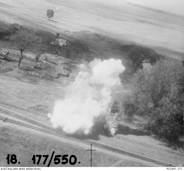 Burma. 14 February 1945. Steam rising from a locomotive at Waw Station ...