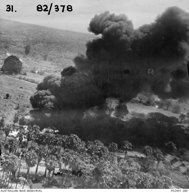 Burma. 25 February 1945. Fires started on the British Oil Company (BOC ...