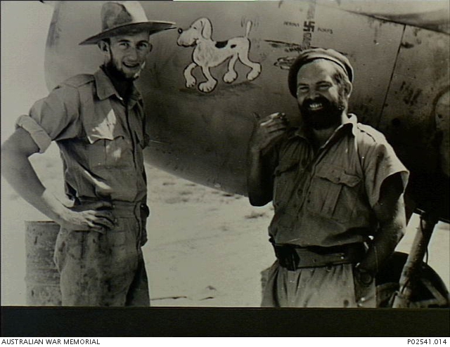 Two members of No 3 Squadron RAAF in front of a Curtiss P-40 Kittyhawk ...