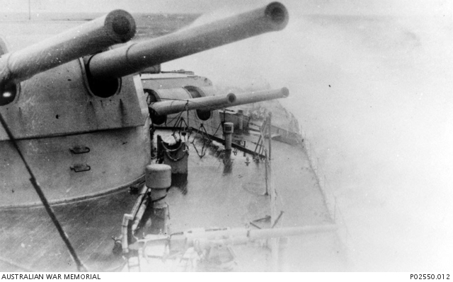 The Kent class cruiser HMAS Canberra makes heavy weather of it during a ...