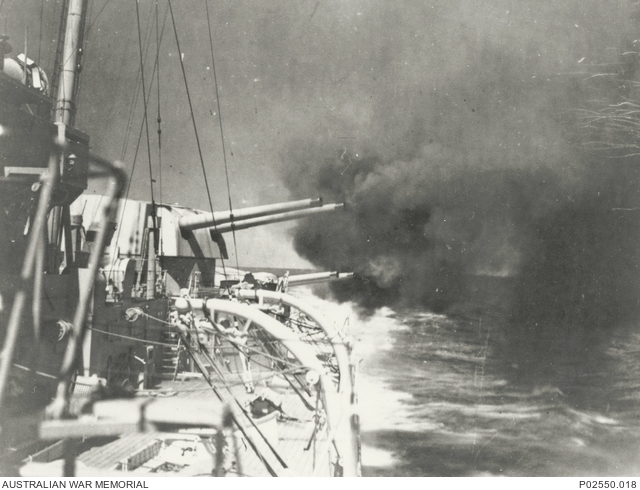 The Kent class cruiser HMAS Canberra conducts a main armament firing ...