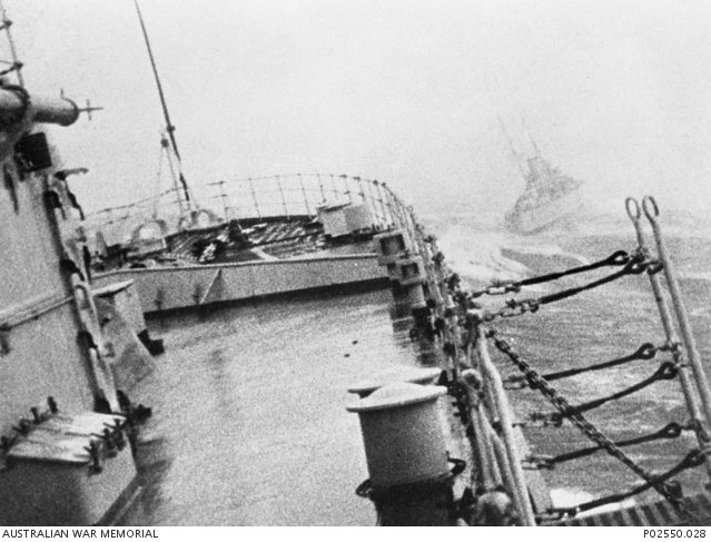 Two RAN ships heel from the effects of a heavy beam sea producing waves ...
