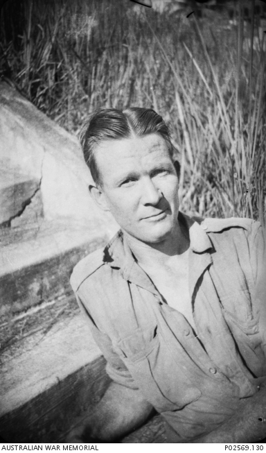 An outdoor portrait of Harry Russell on the steps to the Selarang pump ...