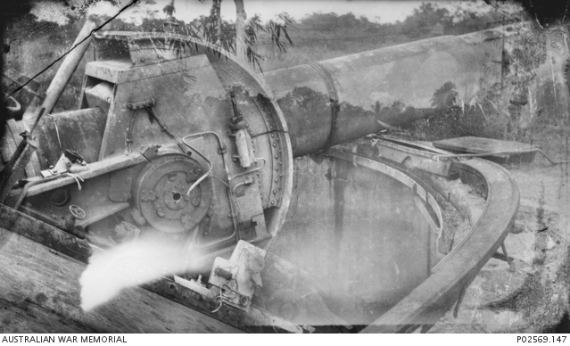A double exposed image featuring the barrel and mount of a wrecked 15 ...