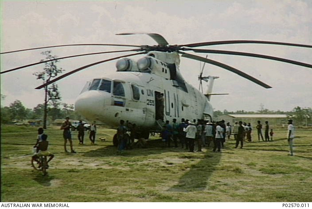 Mean Rith, Cambodia. January 1993. Locals gathered around an United Nations Russian MI-26 ...
