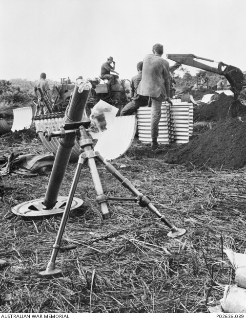 An 81 mm mortar set up and waiting to be emplaced in a mortar pit at ...