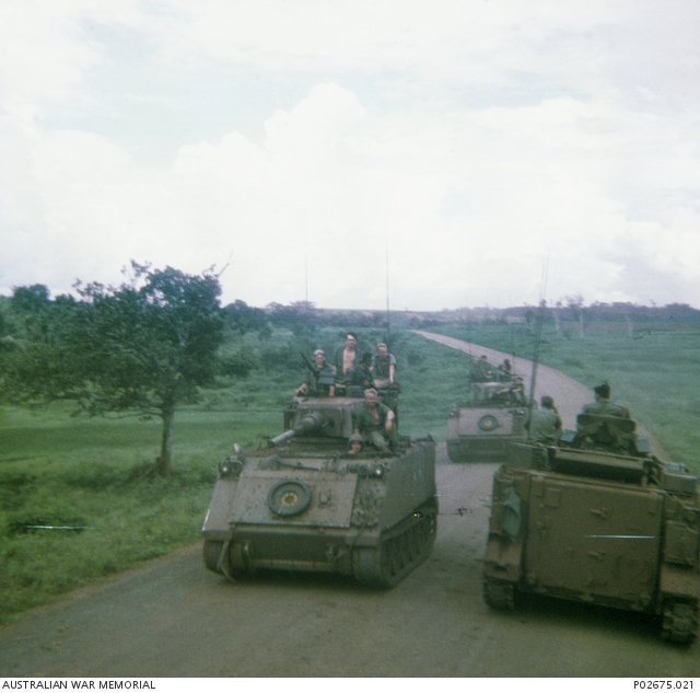 Two M113A1 Fire Support Vehicle (FSVs) (left) passing an M113A1 ...